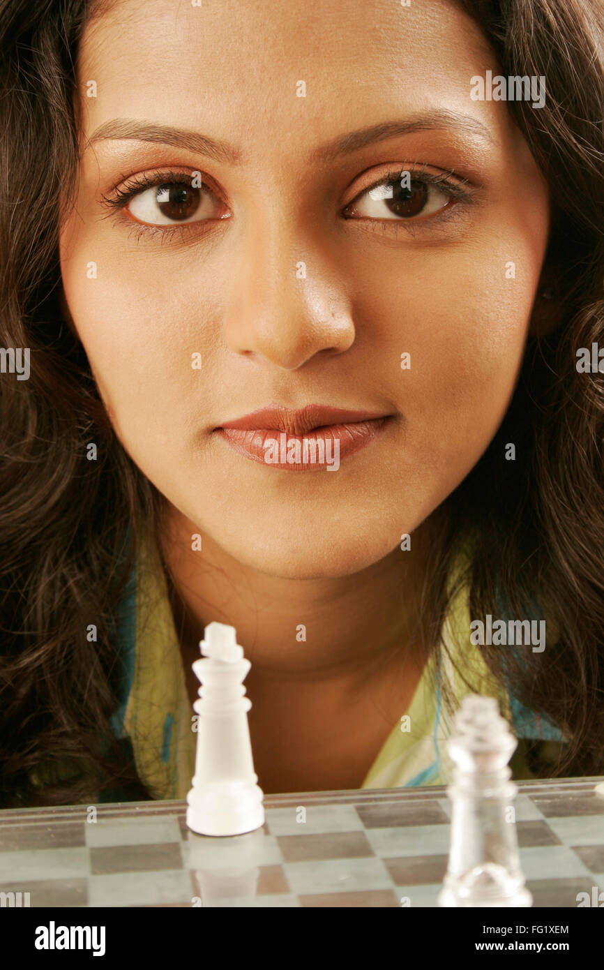 South Asian Indian teenage girl with chess pieces MR#686M Stock Photo ...