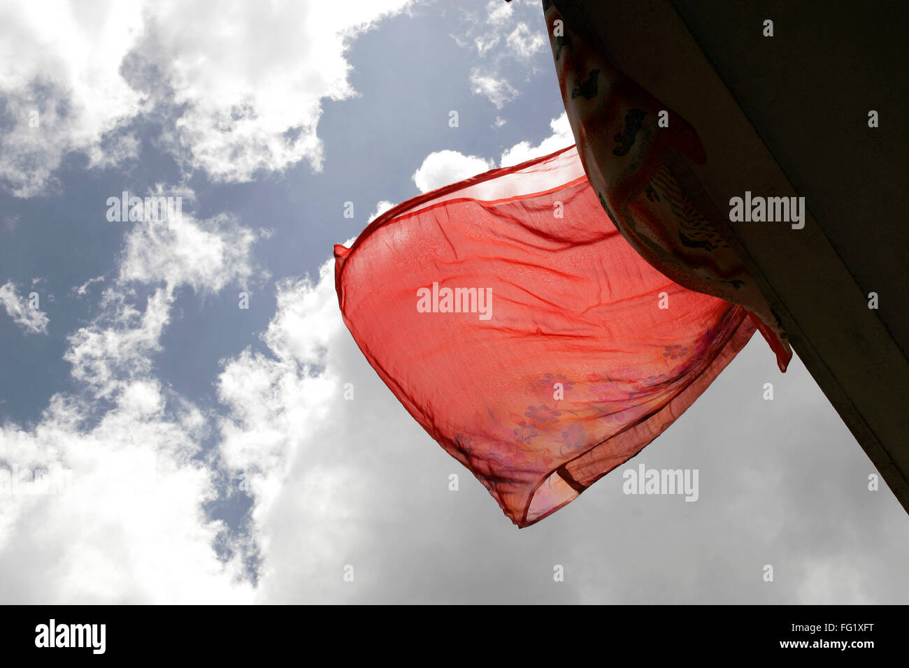 Red saree drying in wind hi-res stock photography and images - Alamy