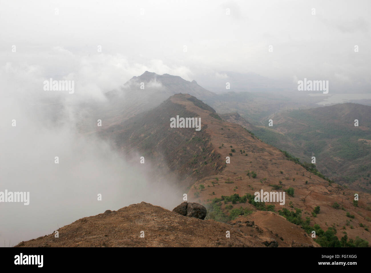 Landscape of western ghat with monsoon clouds rising from valley ...