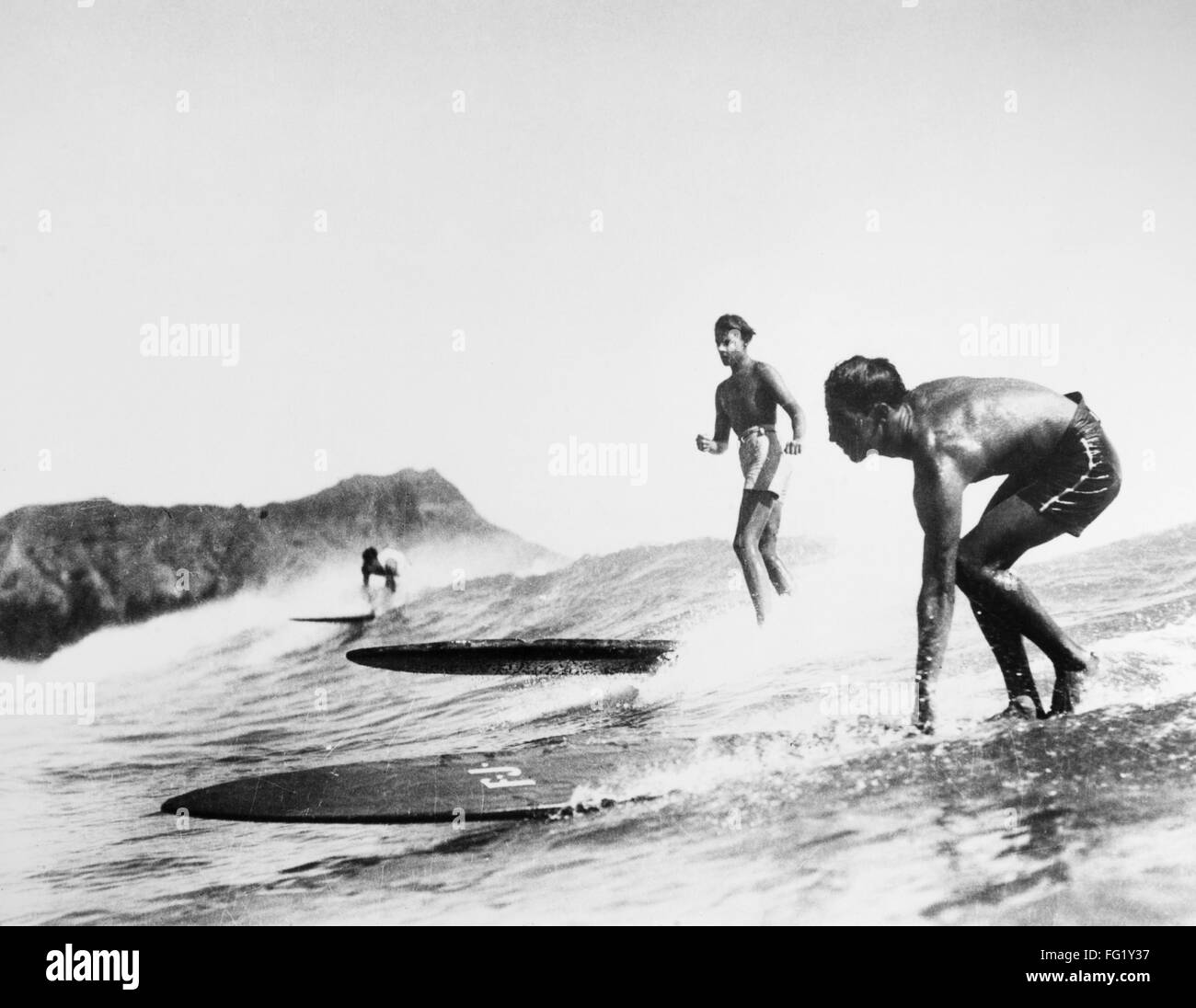 HAWAII: SURFERS, 1953. /nYoung men surfing off the coast of Honolulu ...