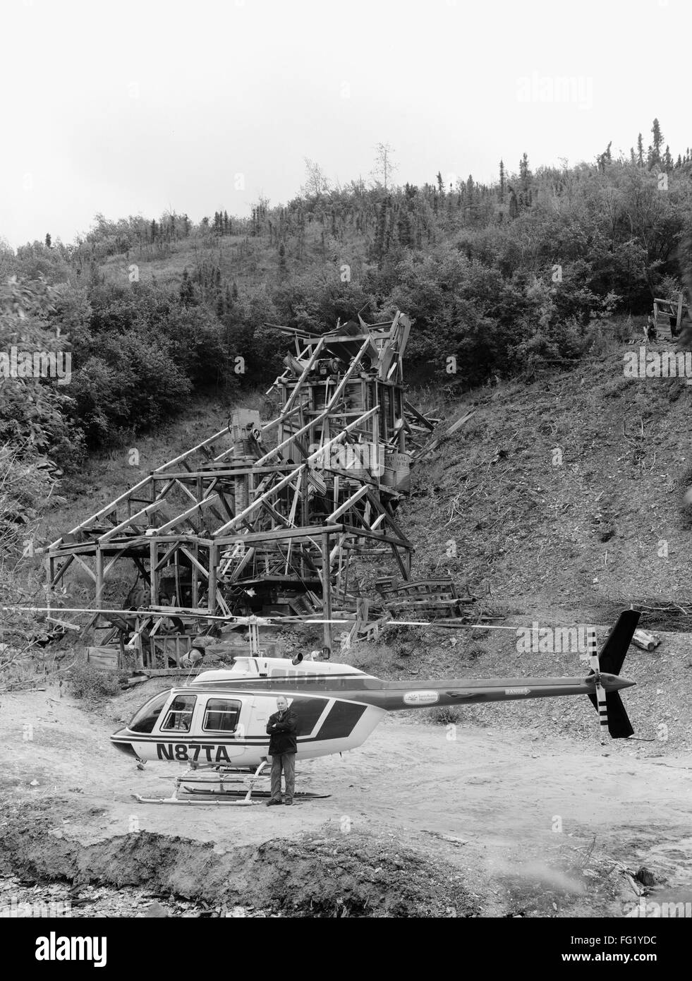 ALASKA: GOLD MINE, 2000. /nPilot Joe Truedale and his helicopter at the ...