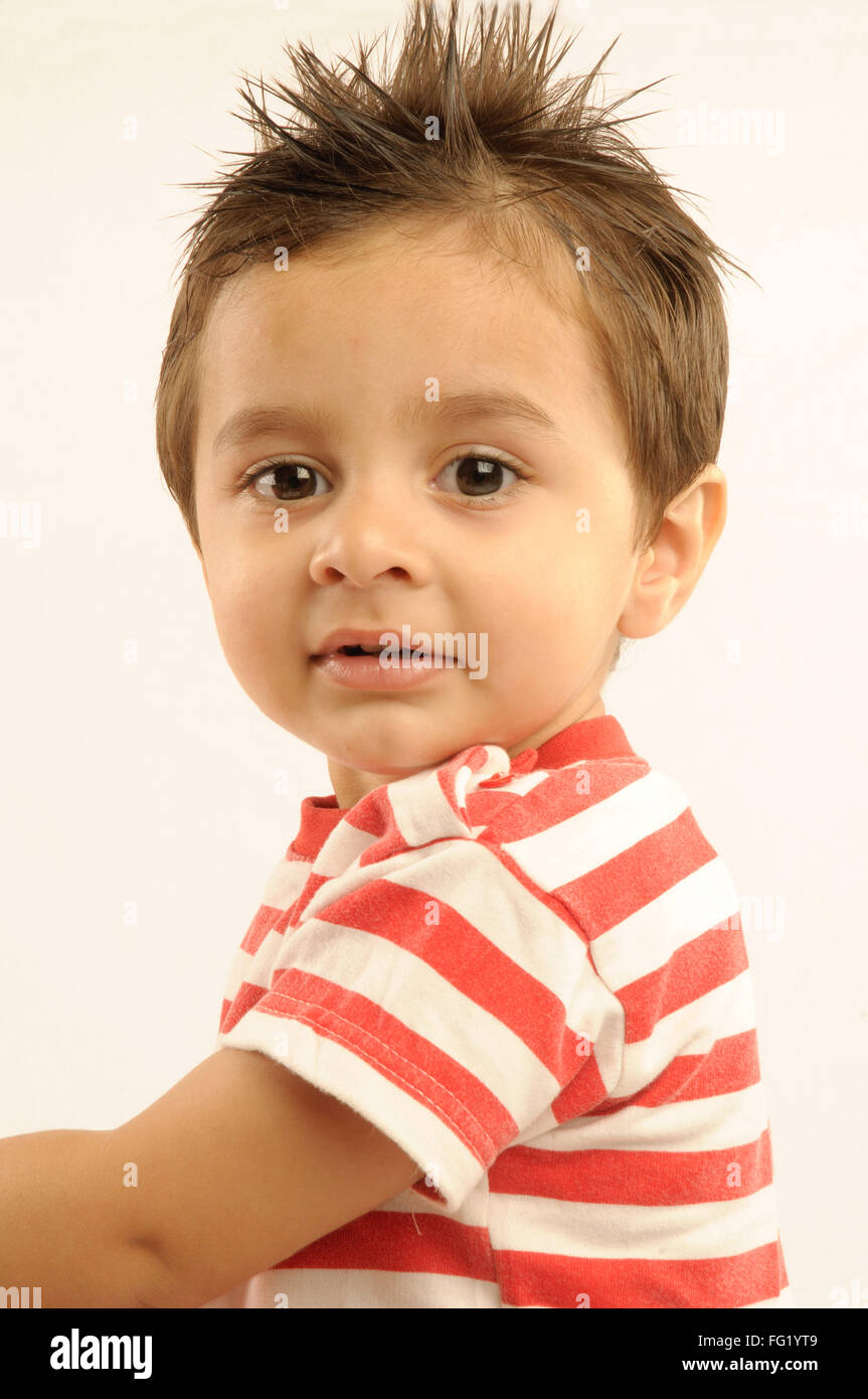 Boy with spiked hair looking anxiously with broad eyes MR#686O 29 June ...