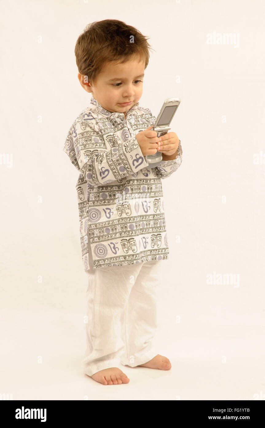Boy keenly looking in mobile phone MR#686O 29 June 2008 Stock Photo - Alamy