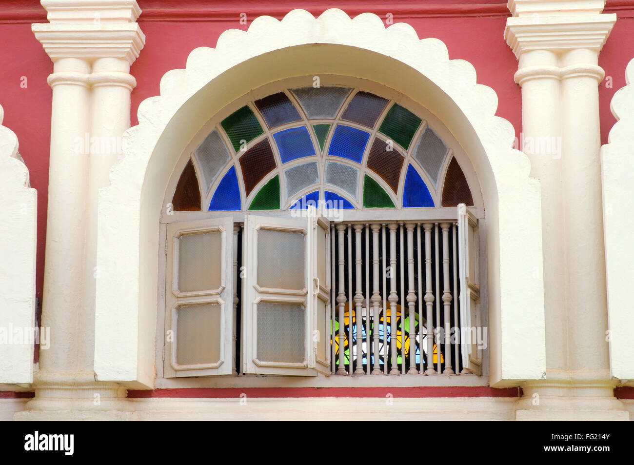 Carved window with stained glass Goa Maharashtra India Asia September ...