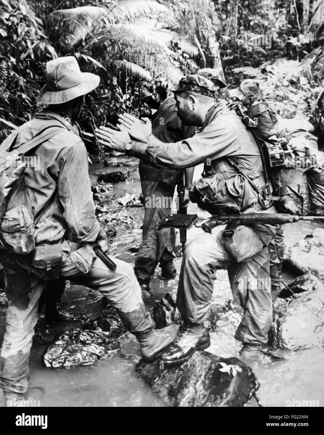 VIETNAM WAR: PATROL, 1964. /nU.S. Army Major David R. Pinney attempting ...