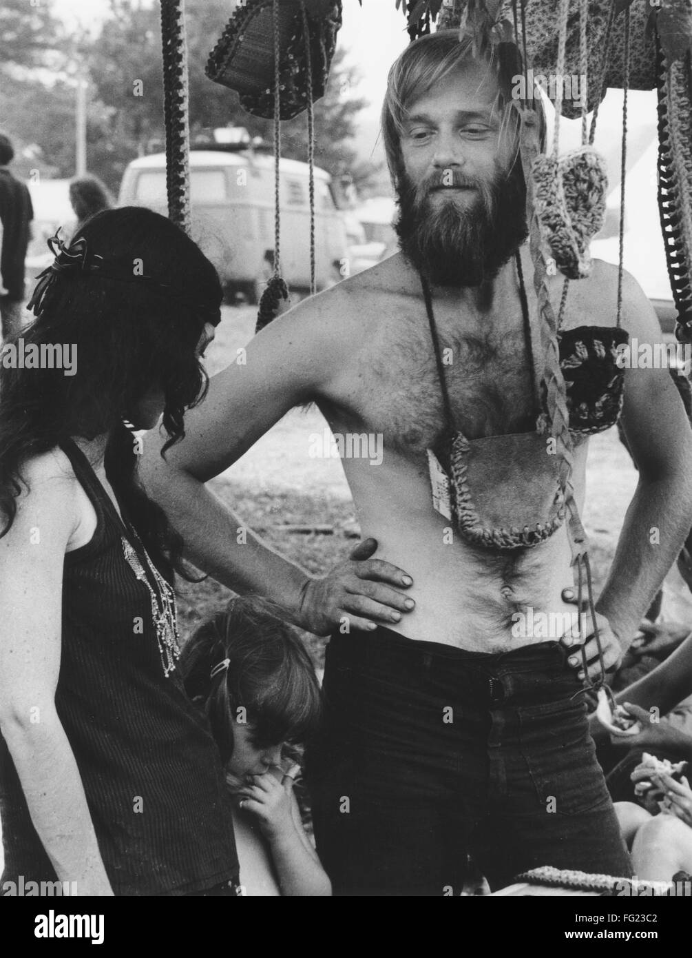 HIPPIE MOVEMENT, 1969. /nA hippie couple with their child share a ...