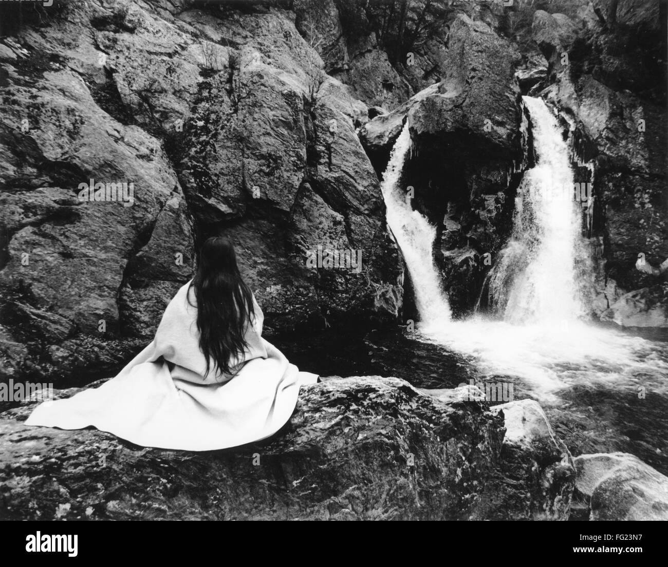 HIPPIE MOVEMENT, 1971. /nA hippie wearing a white cape meditates before ...