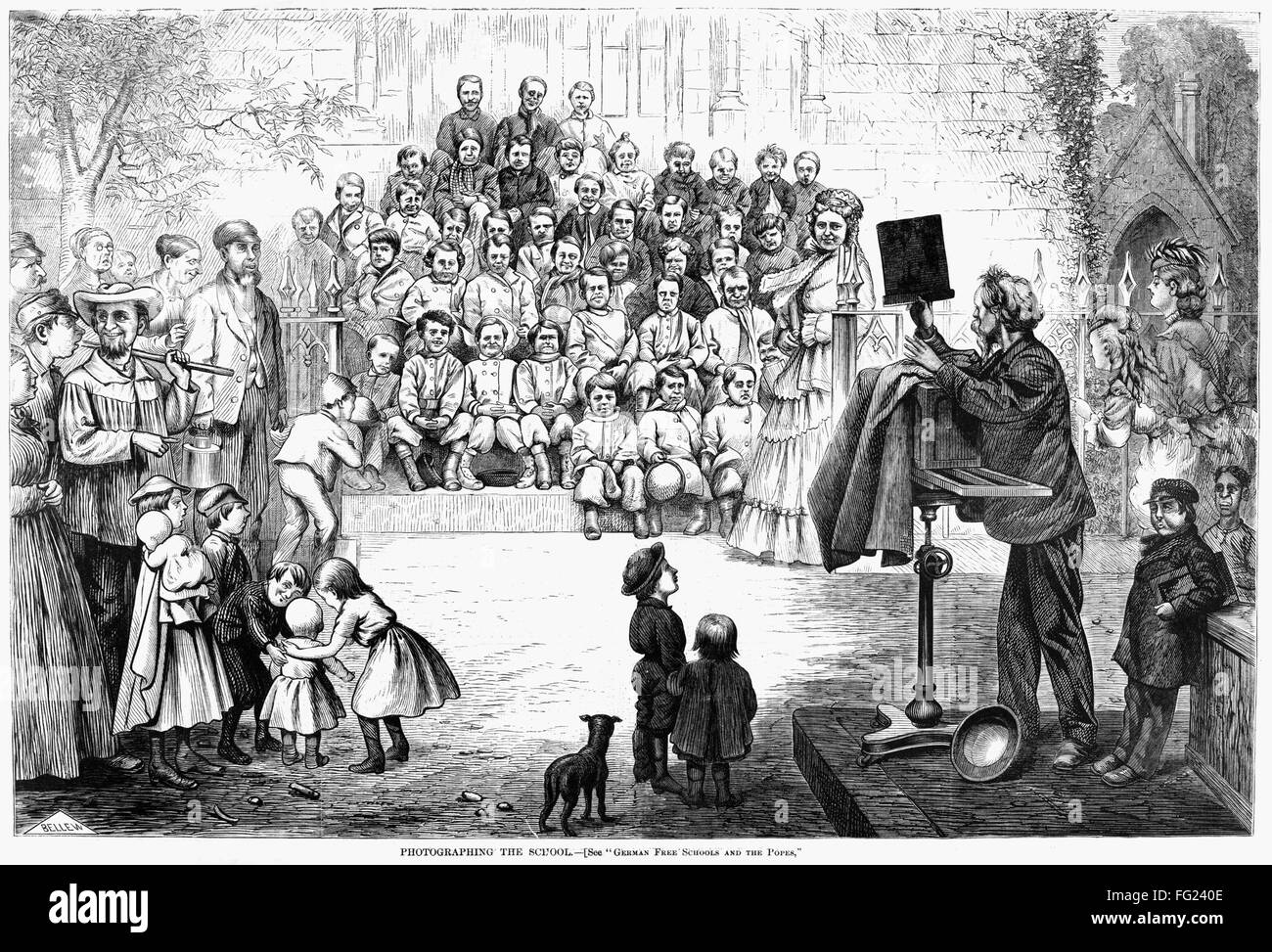 PHOTOGRAPHY: SCHOOL GROUP. /nA photographer taking a picture of a class ...