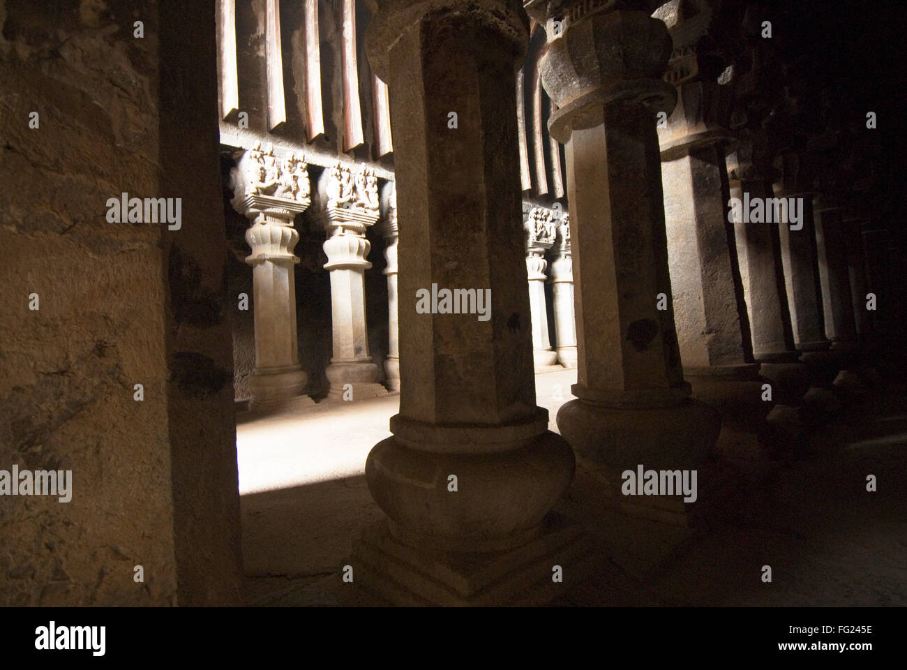 Large size pillars of Karla rock cut cave near hills of Lonavala ...