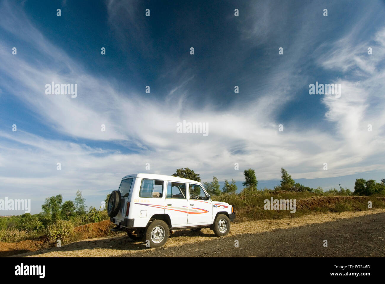 White sumo car under dramatic sky at Chikhaldara ; district Amravati ...