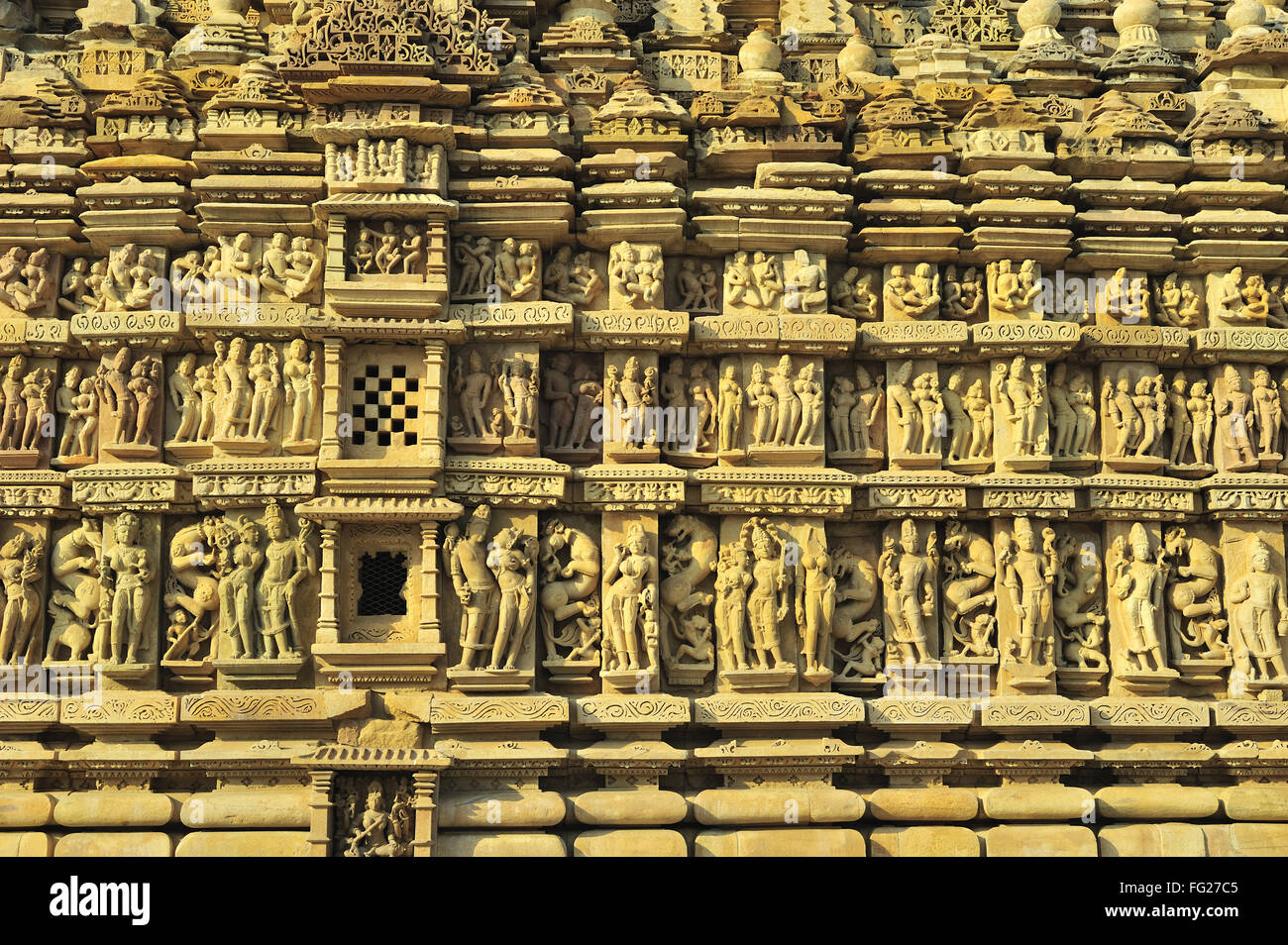intricately carved wall of parsvanath temple Khajuraho madhya pradesh ...
