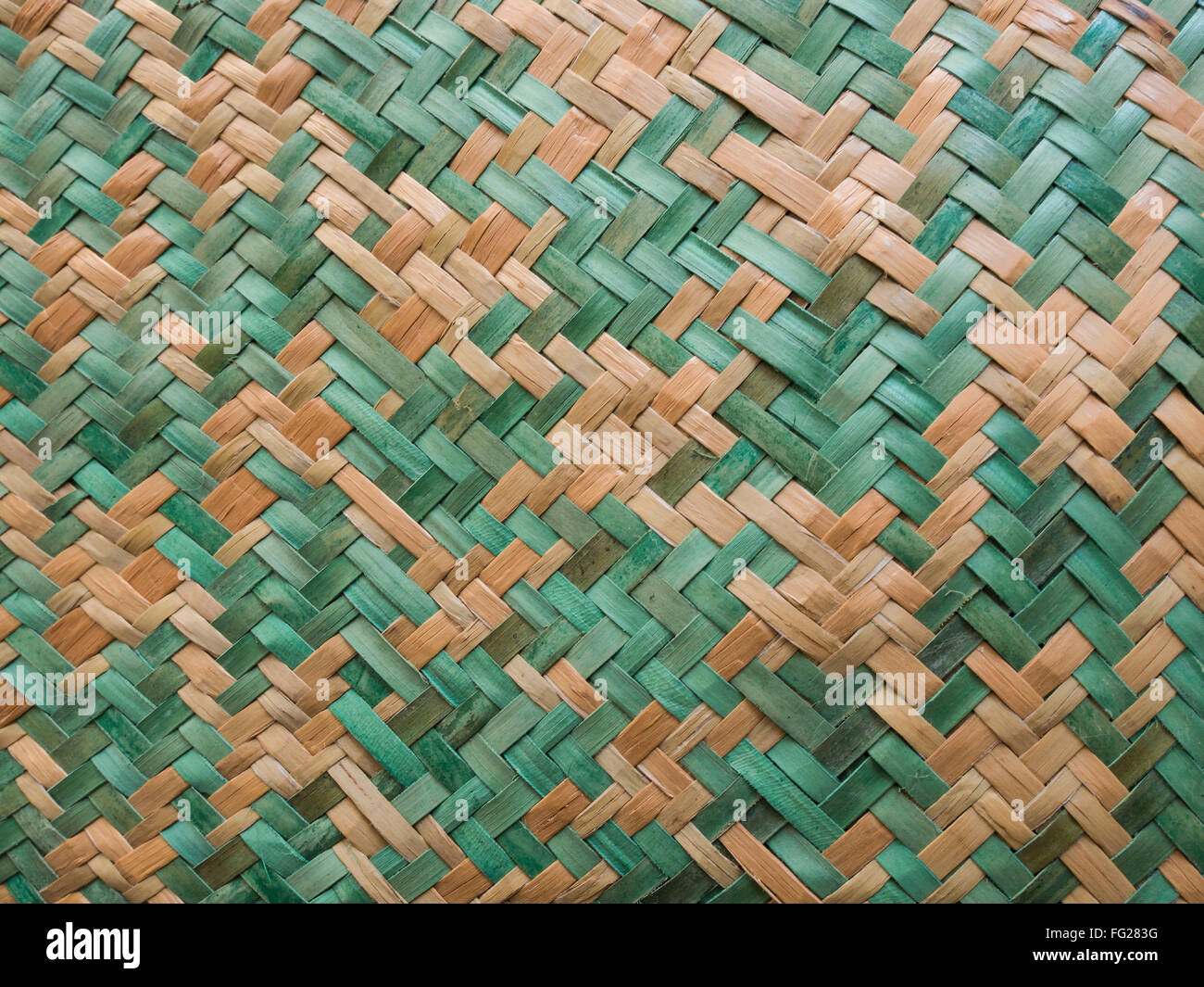 handcraft weave made of natural and green colored vegetable fiber ...