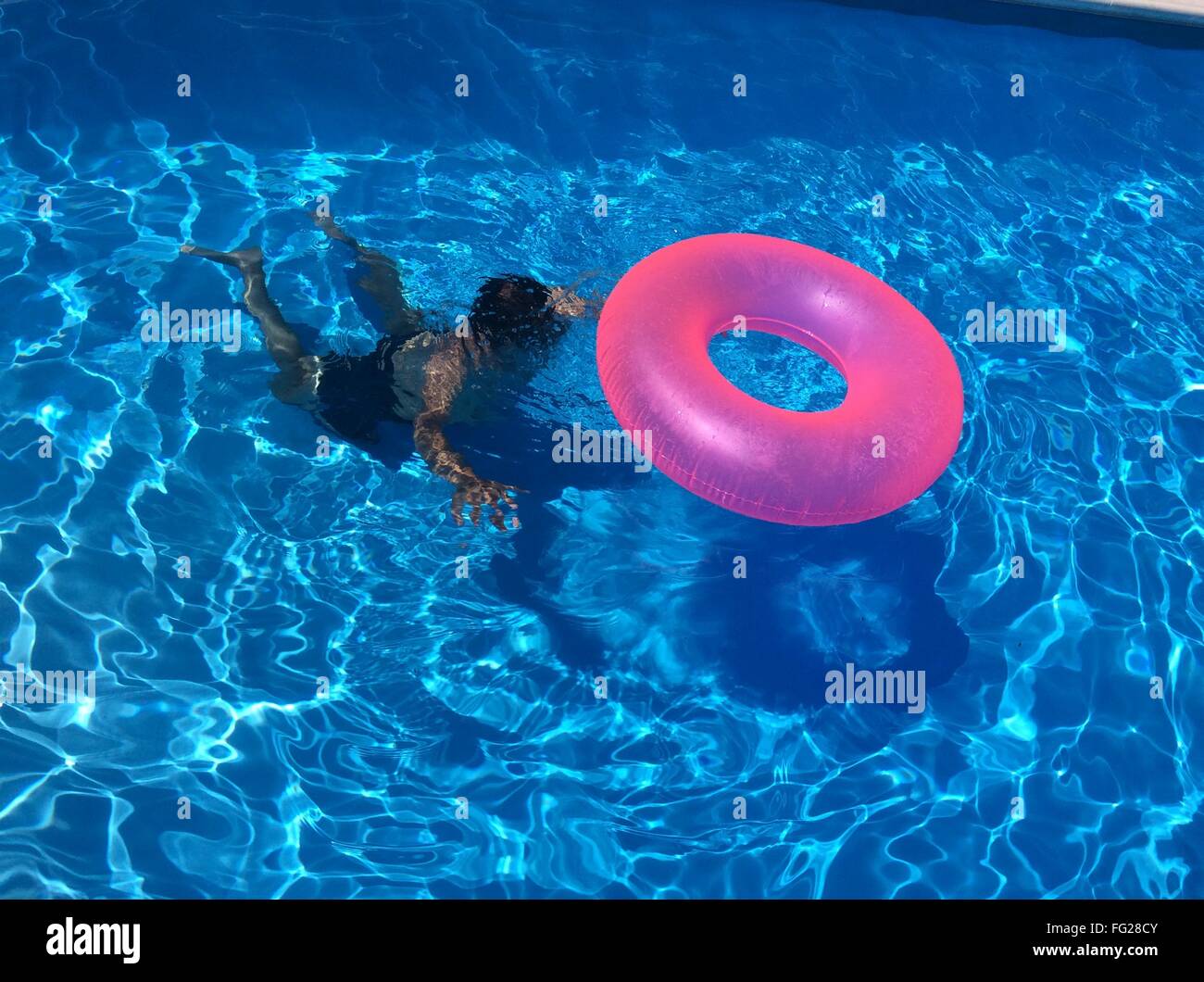 Man Swimming Pool Floating Stock Photos & Man Swimming Pool Floating ...