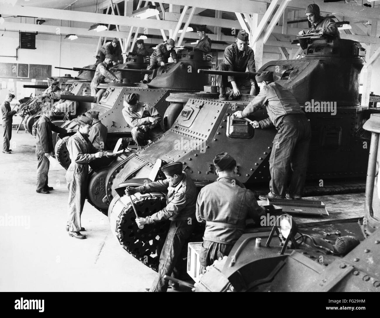 WWII: TRAINING, 1942. /nStudents working on tanks at the Armored Force ...