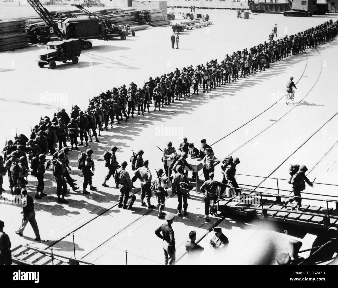 WWII: EMBARKATION, 1942. /nAmerican soldiers lined up at a dock ...