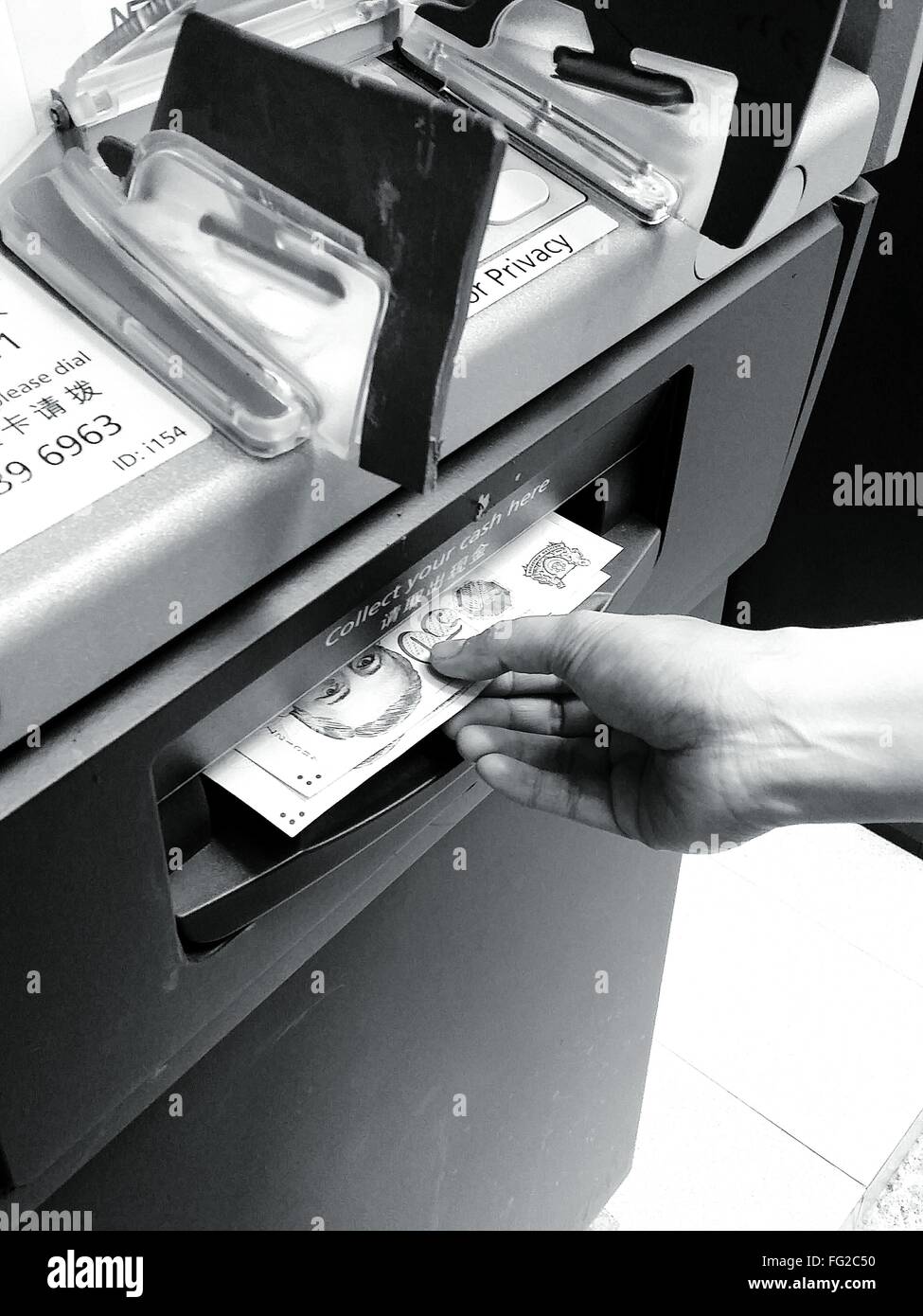 Person withdrawing cash hi-res stock photography and images - Alamy