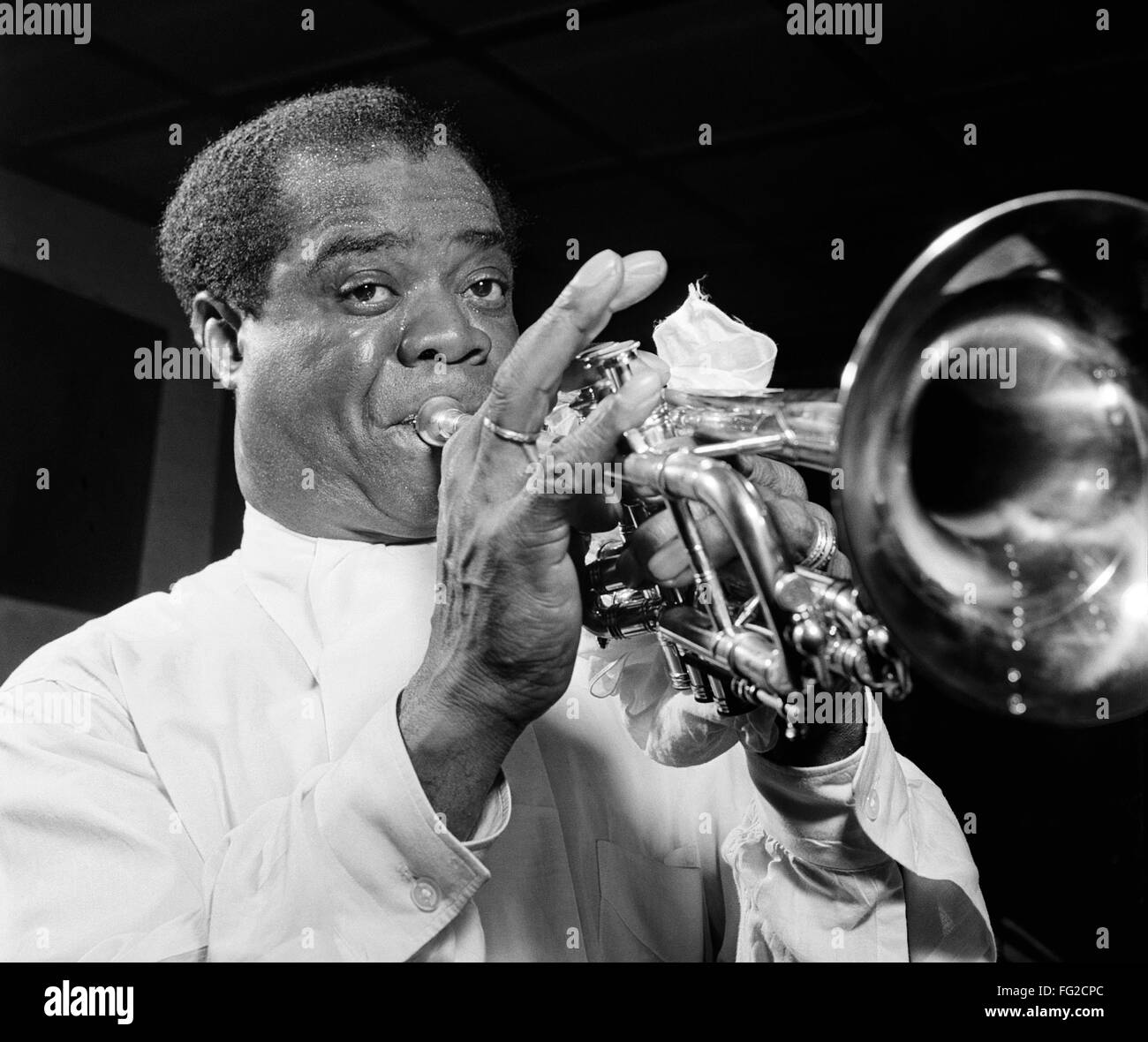 LOUIS ARMSTRONG (1900-1971). /nAmerican jazz musician. Performing at ...