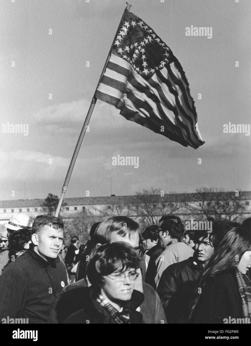 ANTI-WAR PROTEST, 1969. /nProtesters waving an American flag with a ...