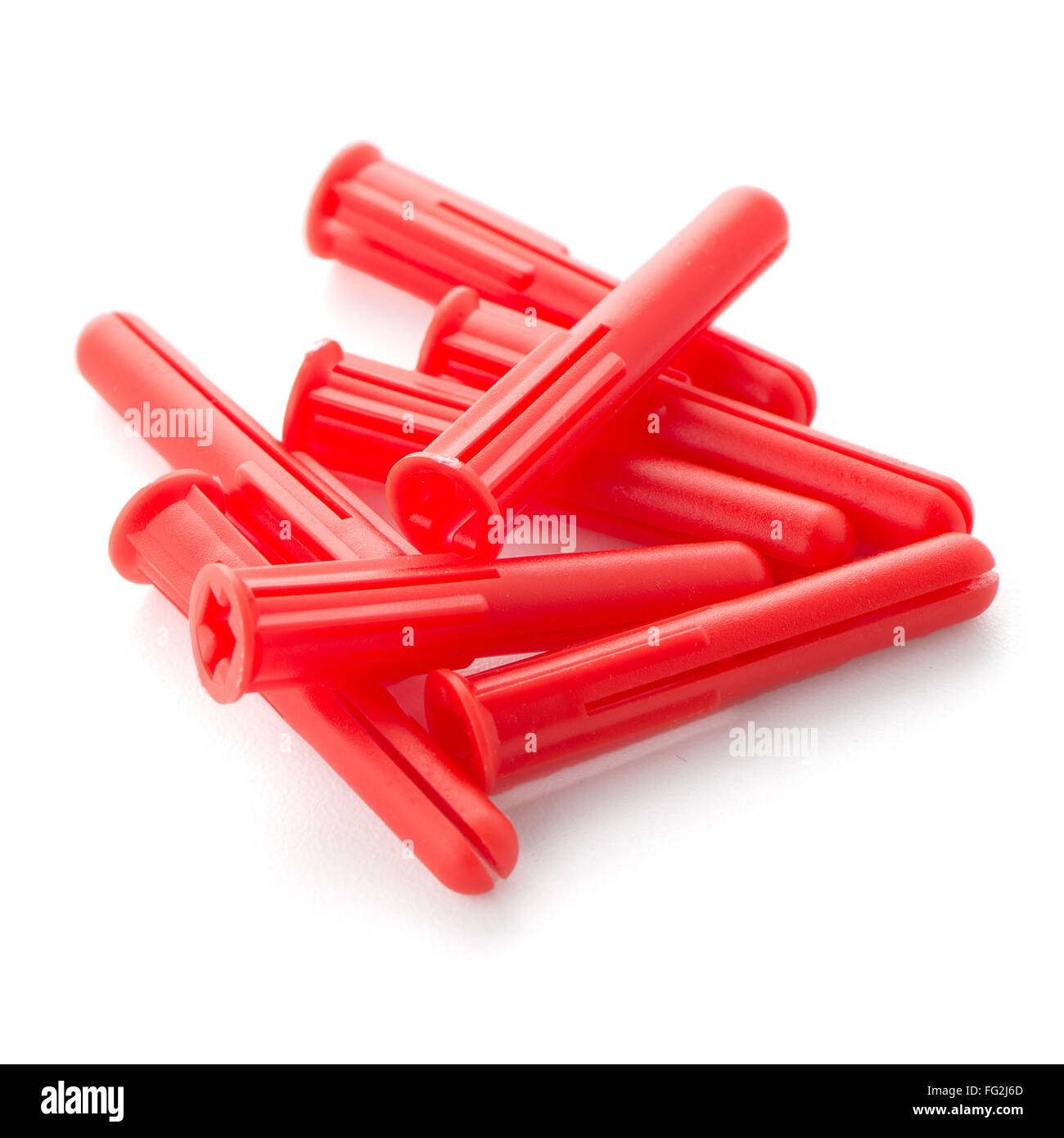 Red plastic dowels isolated on white background Stock Photo - Alamy