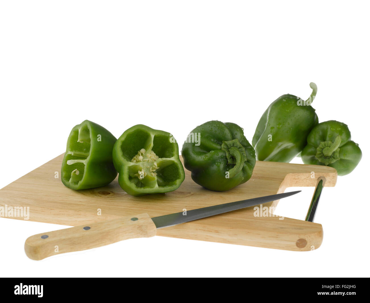 Vegetables ; capsicum with cutting board and knife on white background ...