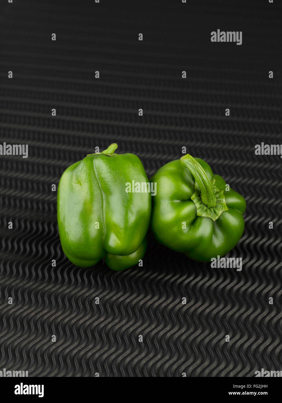 Vegetables ; capsicum on black waves background Stock Photo - Alamy