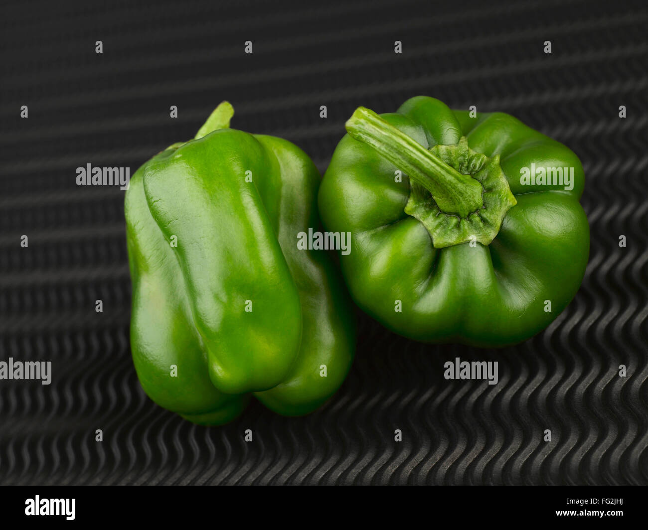 Vegetables ; capsicum on black waves background Stock Photo - Alamy