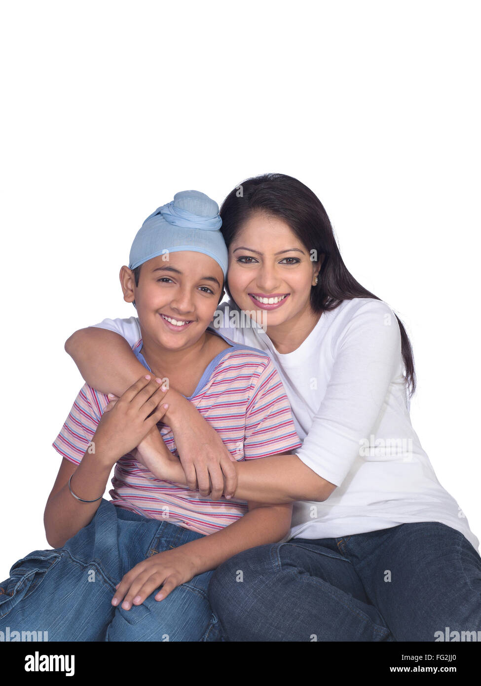 Sikh lady hugging son MR#702Z;702Y Stock Photo - Alamy