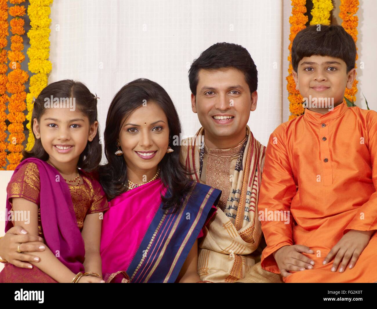 Parents with children in traditional wearing sitting in house MR#702R ...