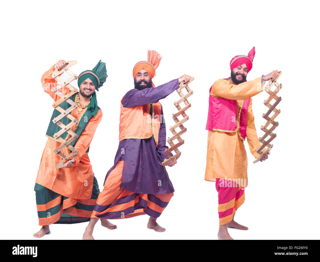 Dancers playing musical instrument performing folk dance bhangra MR ...