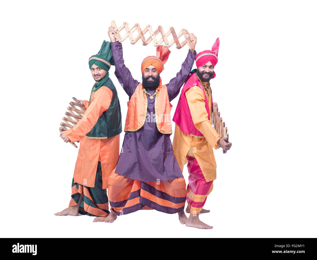 Dancers playing musical instrument performing folk dance bhangra MR ...