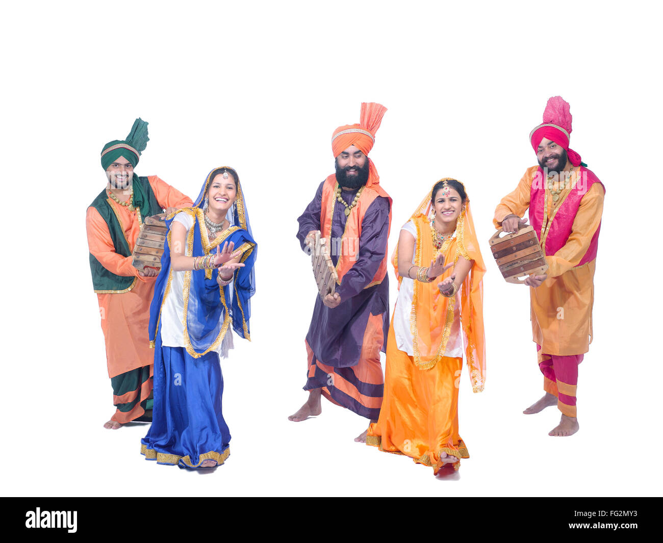 Dancers playing musical instrument performing folk dance bhangra MR ...