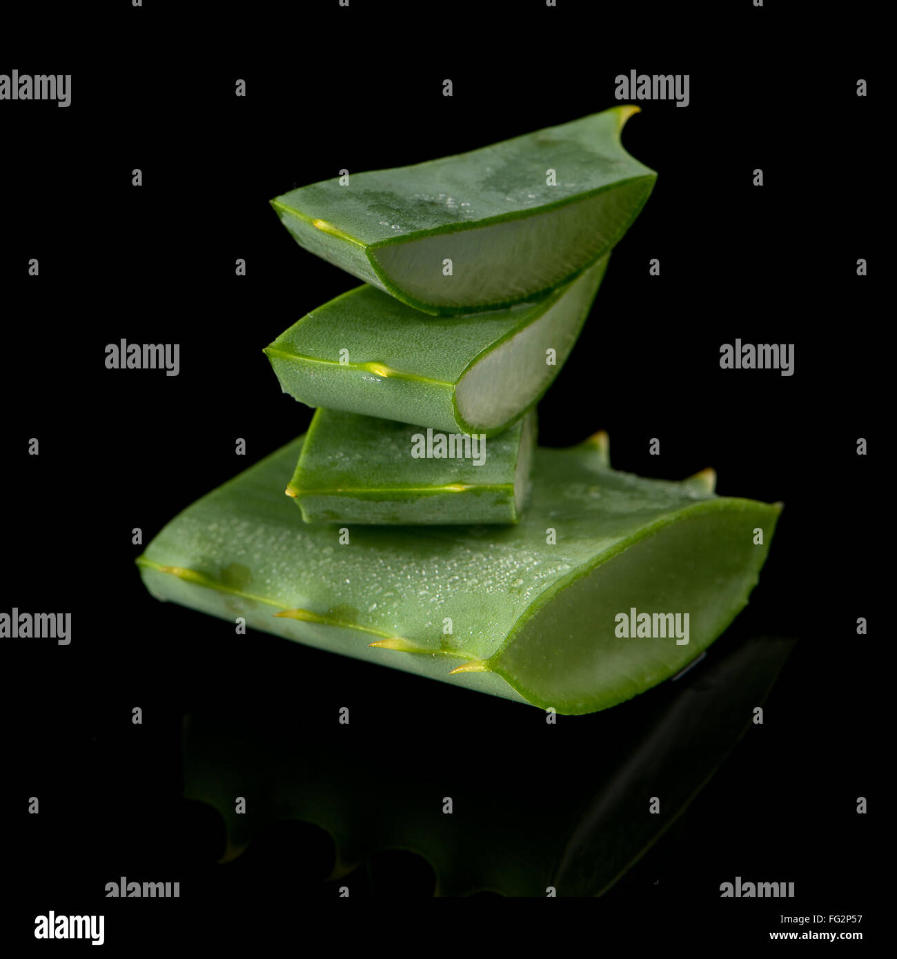 Sliced aloe leaf and water drops isolated on black background Stock ...