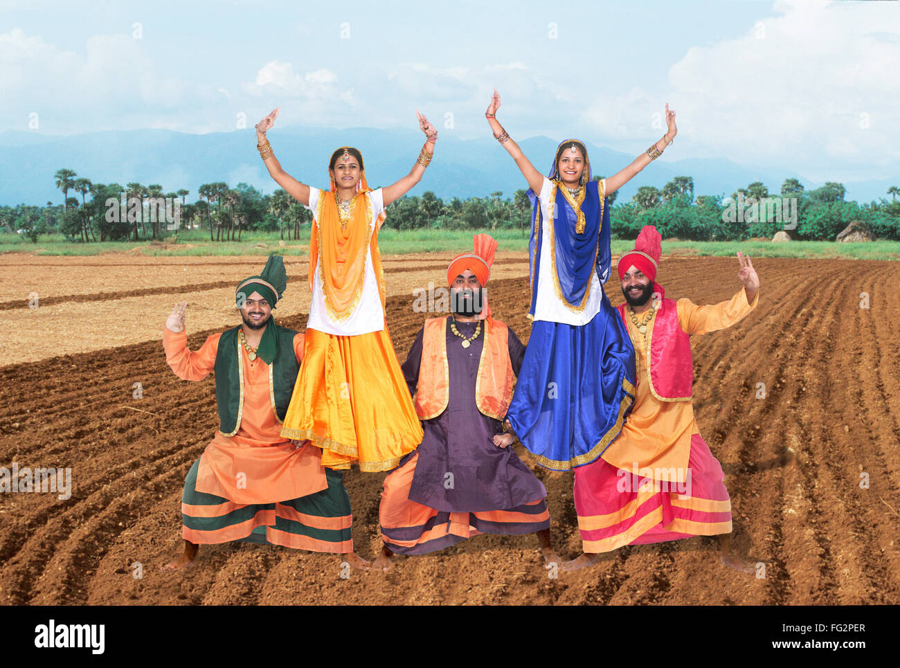 Dancers performing folk dance bhangra in field MR#779F;779E;779C;779D ...