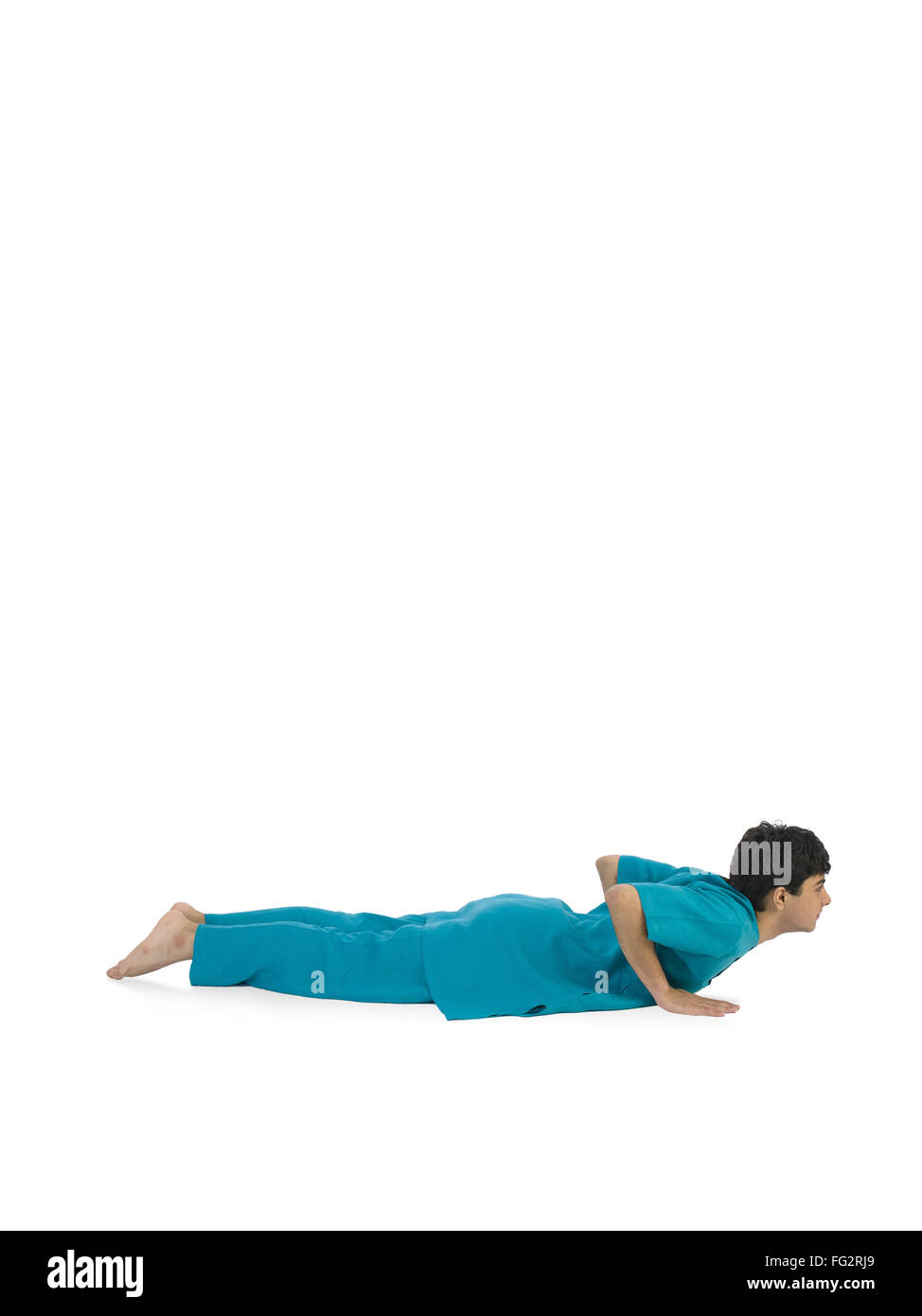 Boy practicing bhujang asana hi-res stock photography and images - Alamy