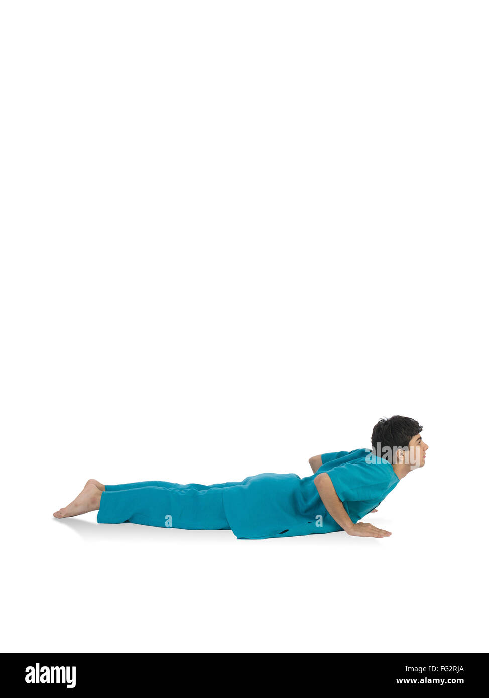 Boy practicing bhujang asana hi-res stock photography and images - Alamy