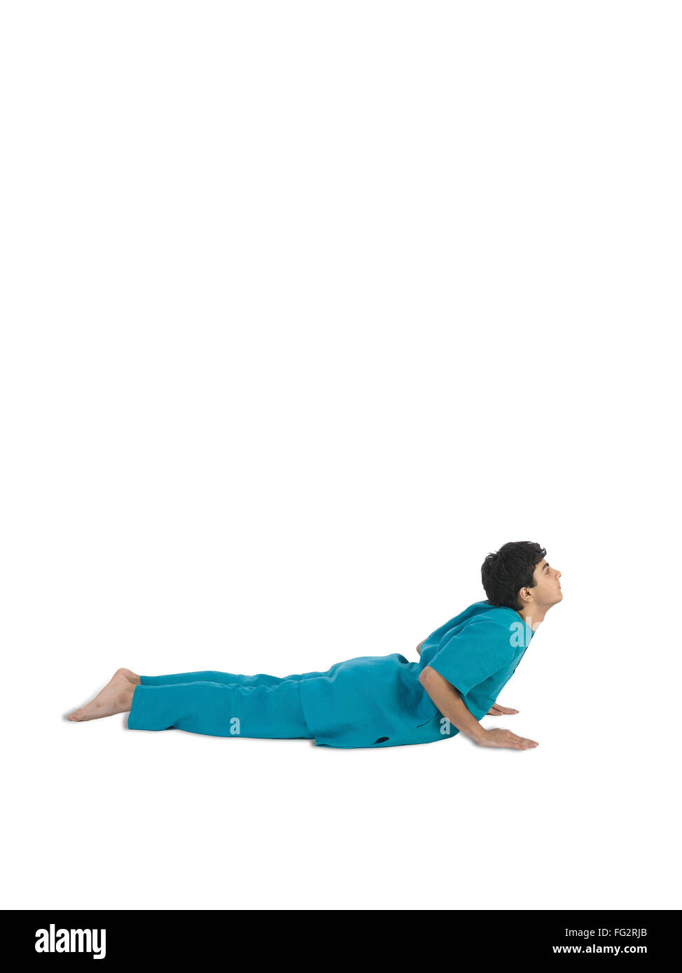 Boy practicing bhujang asana MR#779I Stock Photo - Alamy