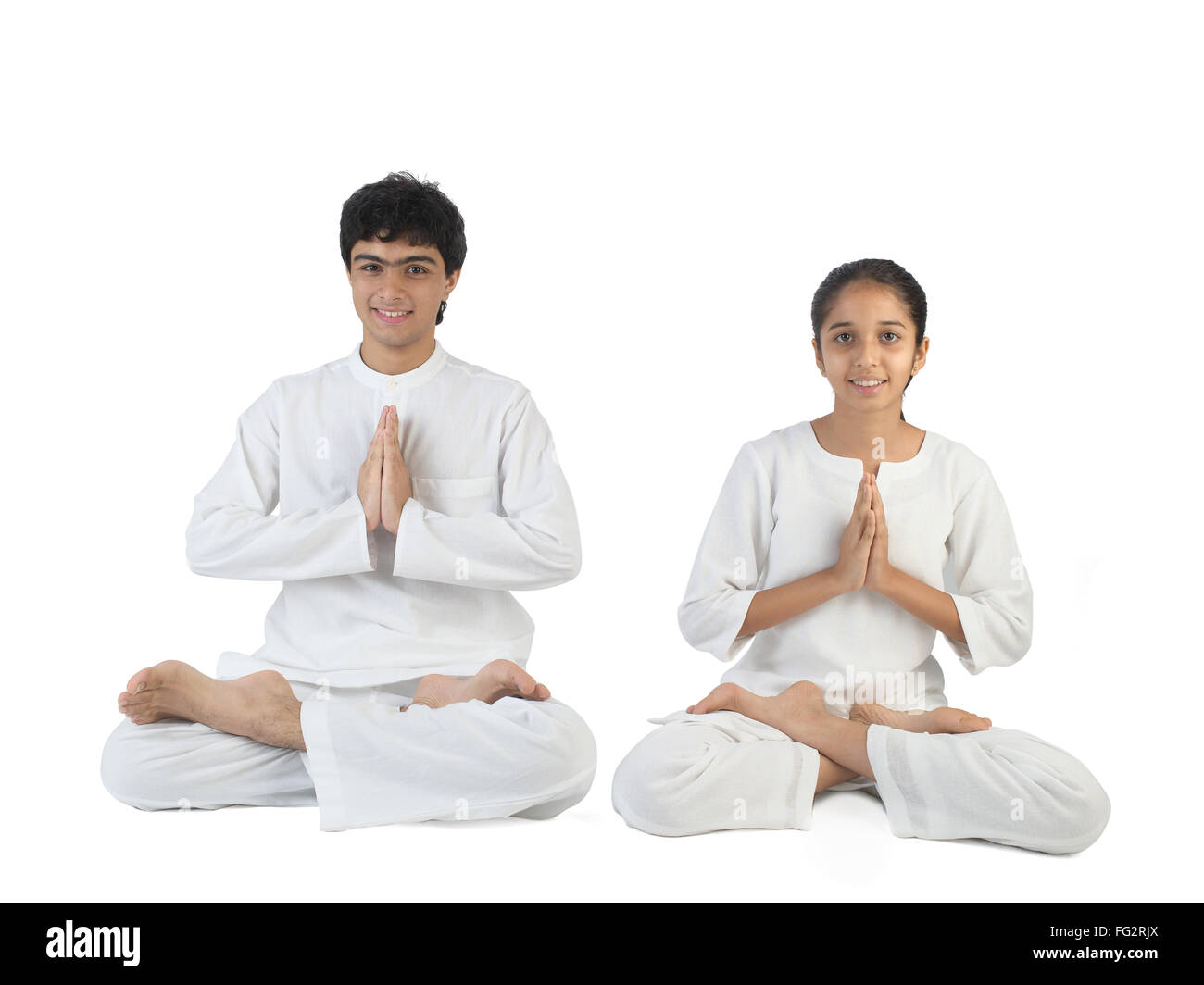 Boy and girl practicing yoga MR#779I;779J Stock Photo - Alamy