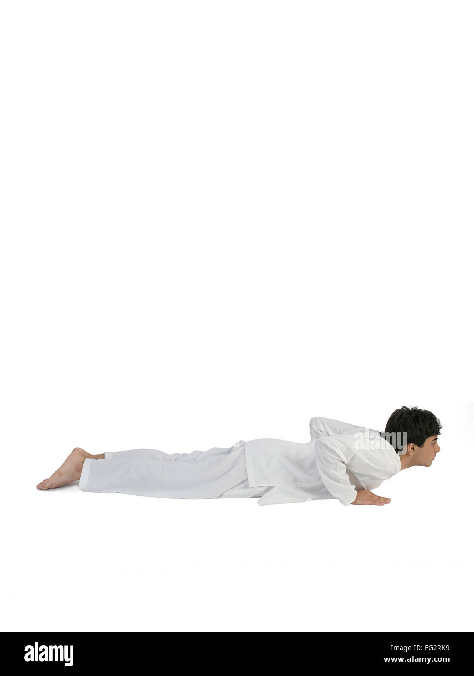 Boy practicing bhujang asana hi-res stock photography and images - Alamy