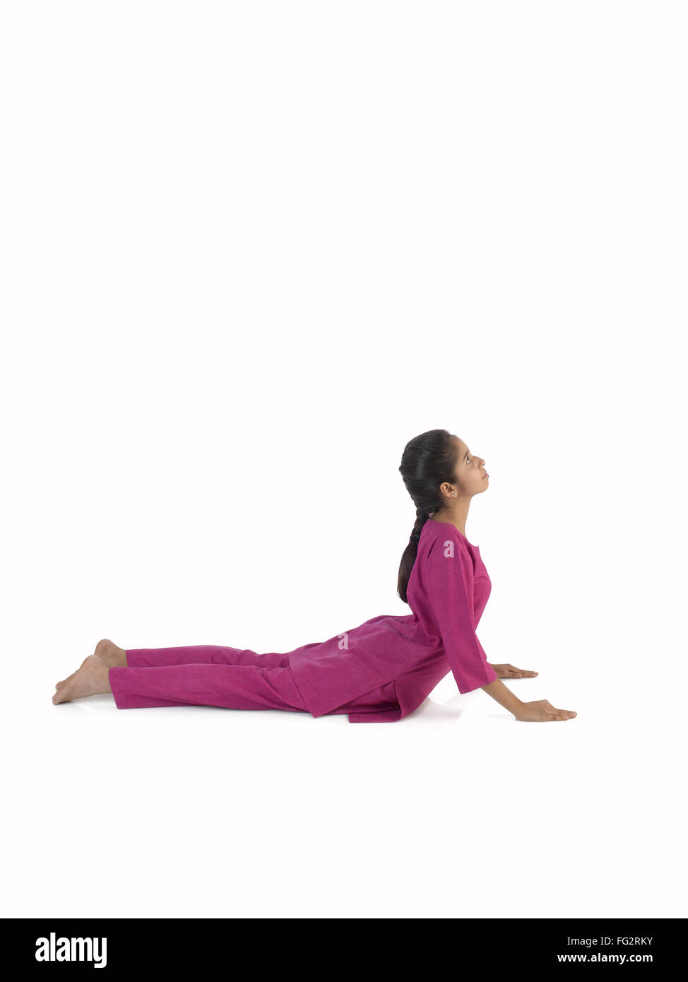 Girl practicing bhujang asana MR#779J Stock Photo - Alamy
