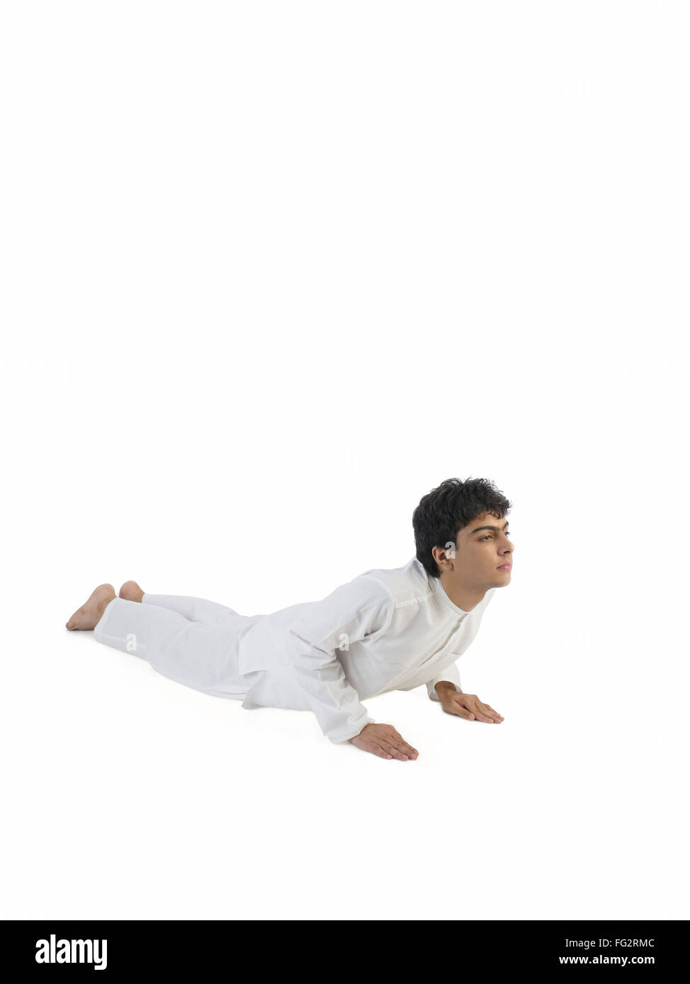 Boy practicing bhujang asana MR#779I Stock Photo - Alamy