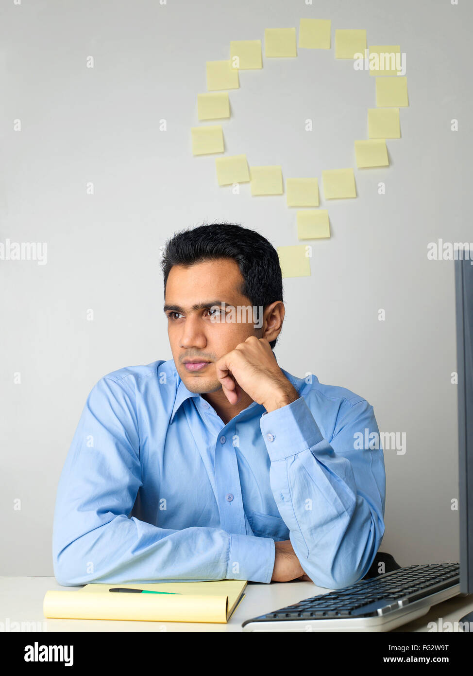 Executive thinking sticky notes on wall in background MR#779K Stock ...