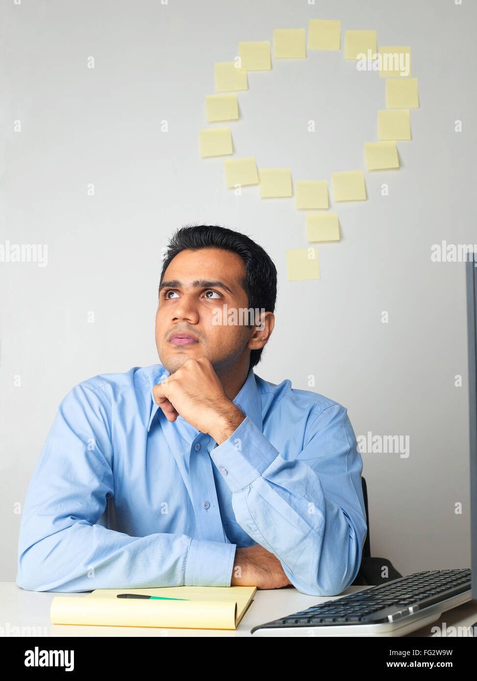 Executive thinking sticky notes on wall in background MR#779K Stock ...