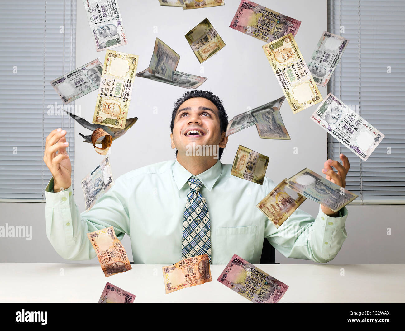 Indian business man falling money hi-res stock photography and images ...