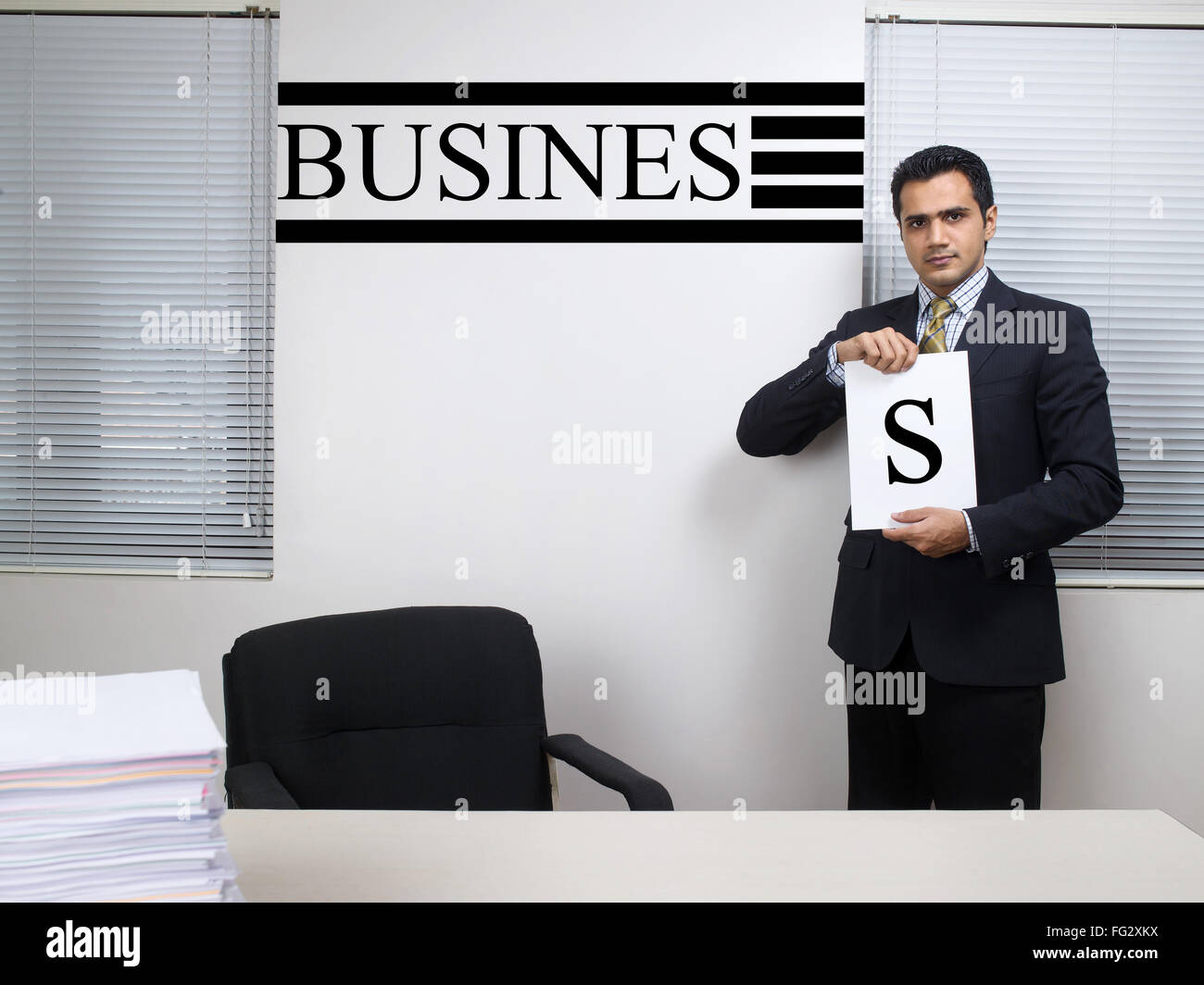 Executive showing word S of business MR#779K Stock Photo - Alamy