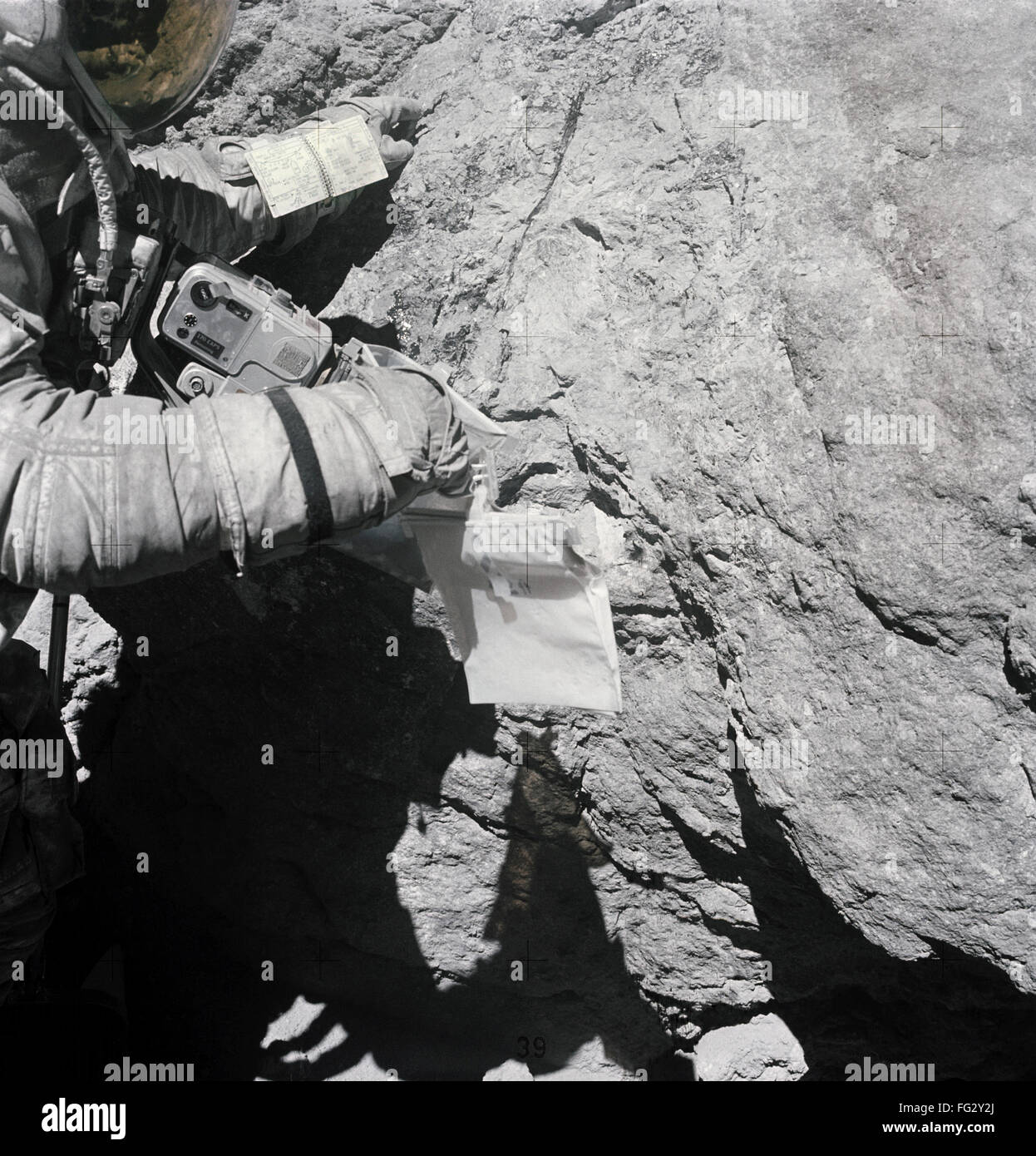 APOLLO 16: ASTRONAUT, 1972. /nAstronaut Charles M. Duke Jr. examining a ...