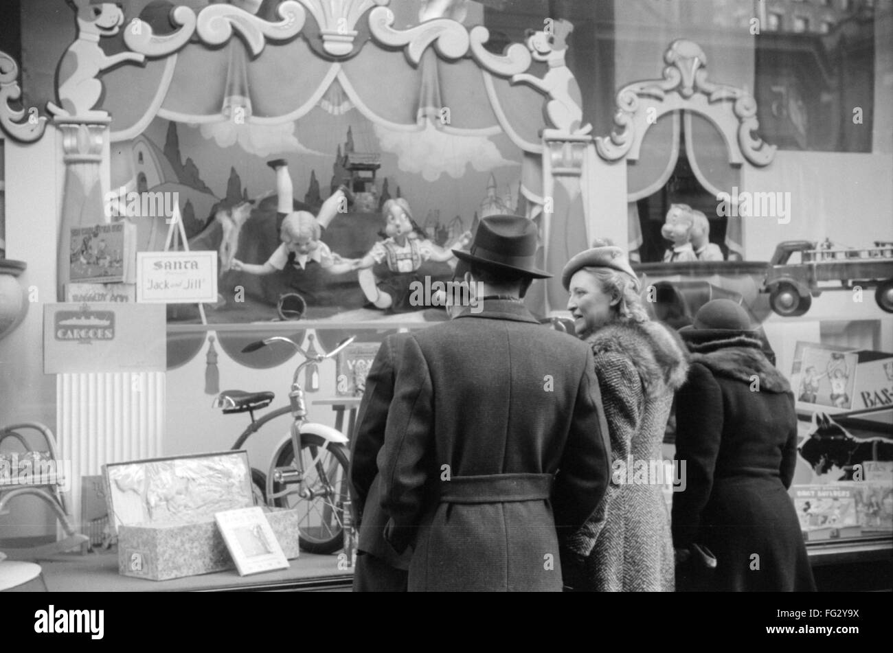 WINDOW SHOPPING, 1940. /nWindow shoppers looking at toys in the window ...