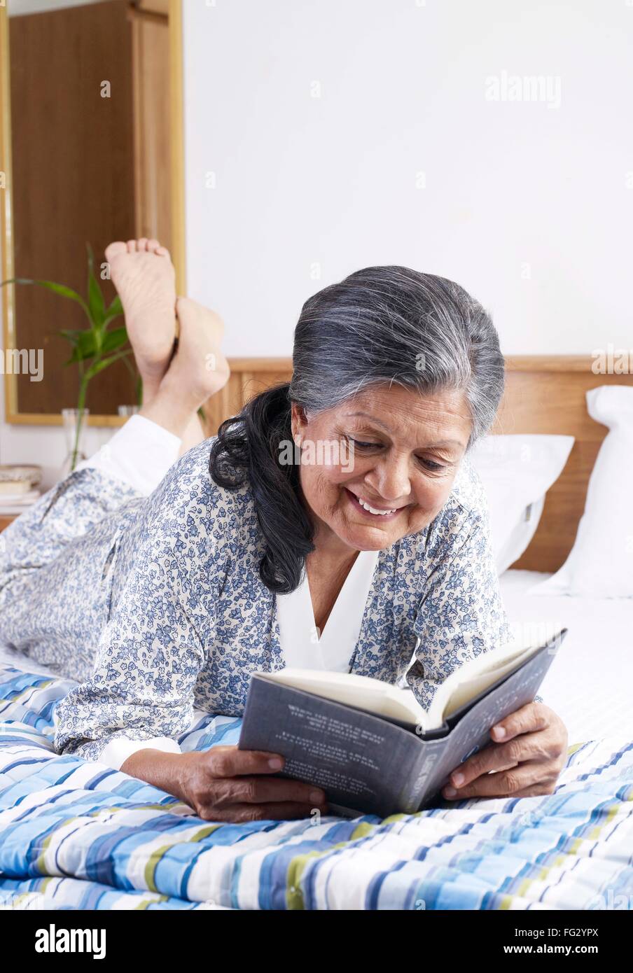 Indian old woman reading book hi-res stock photography and images - Alamy