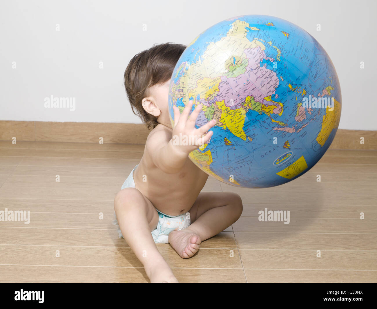 Baby boy girl globe hi-res stock photography and images - Alamy