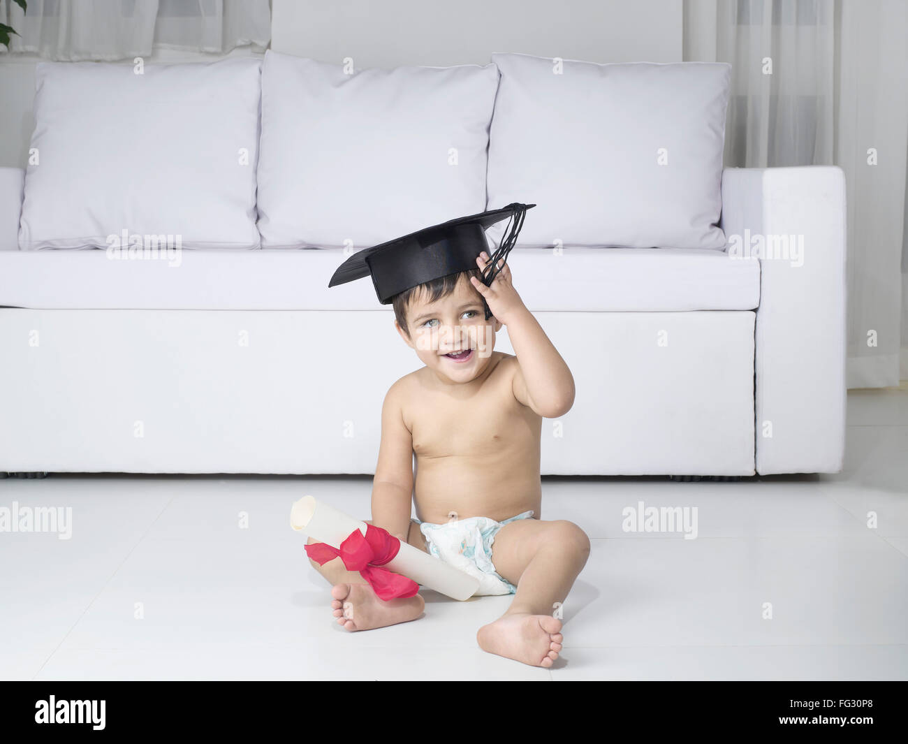 Baby graduation hat hi-res stock photography and images - Alamy