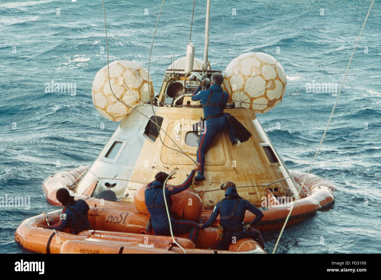 SKYLAB: SPLASHDOWN, 1973. /nNavy swimmers attaching a flotation collar ...